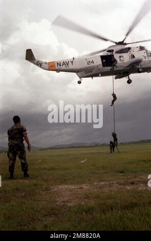 Members of Fleet Composite Squadron 6 (VC-6) run pre-launch tests on a ...