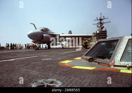 A safety observer signals instructions to the pilot of an S-3A Viking ...