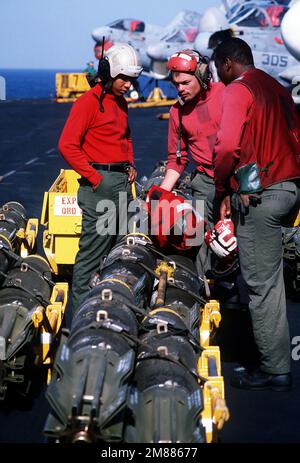 Ordnancemen of Attack Squadron 165 (VA-165) prepare to load Mark 82 500 ...