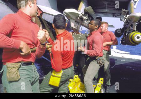 Ordnancemen of Attack Squadron 165 (VA-165) mount a Mark 82 500-pound ...