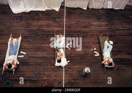 Detainees from the captured Iranian mine-laying ship IRAN AJR rest ...