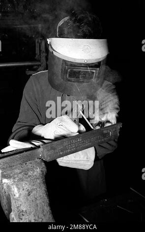 Fireman Apprentice Pam Grey practices using an arc welder to fuse metal ...