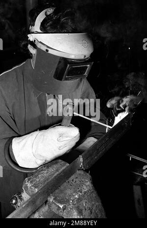 Fireman Apprentice Pam Grey practices using an arc welder to fuse metal ...