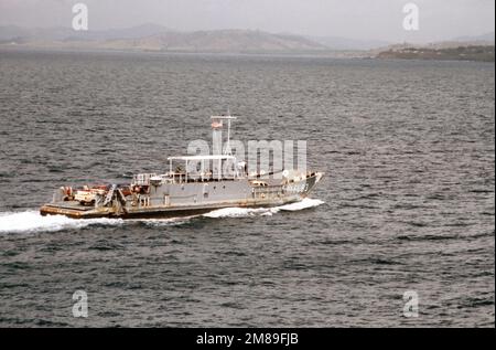 The harbor utility craft YFU-83 moves past the maritime pre-positioning ...