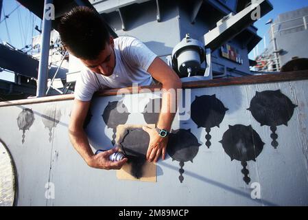 The ocean minesweeper USS INFLICT (MSO-456) and an RH-53D Sea Stallion ...