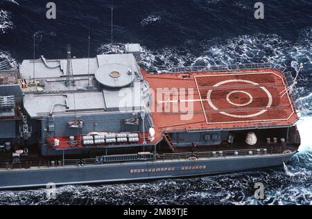 A view of the helicopter hangars and helicopter pad, with crewmen ...