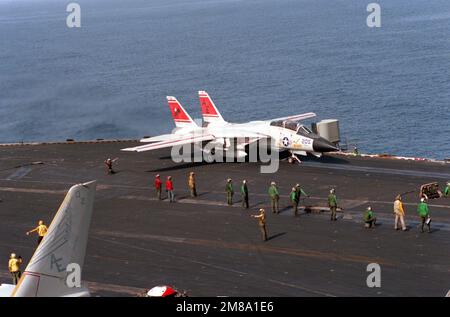 A Fighter Squadron 31 (VF-31) F-14A Tomcat aircraft accelerates down ...