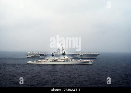 Crew members man the rails of the 6th Fleet flagship USS BELKNAP (CG-26 ...