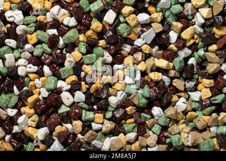 Heap shaped pebble chocolate. Stone-shaped chocolate with a sugar ...