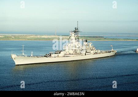 A port bow view of the battleship WISCONSIN (BB-64) firing its Mark 7 ...