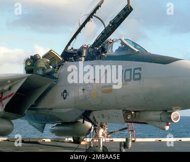 Flight deck crewmen service Fighter Squadron 74 (VF-74) F-14A Plus ...