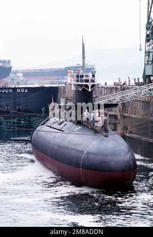 Crew members stand at the railing of the attack submarine USS BARBEL ...