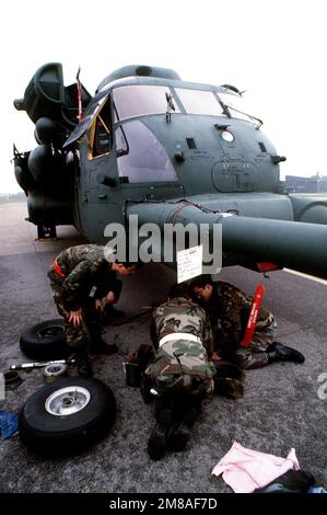 Members of the 21st Special Operations Squadron prepare an MH-53J ...