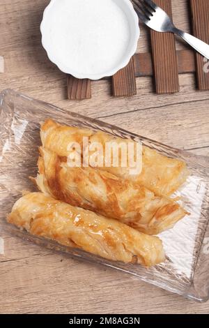 Fried Roti with Sweetened Condensed Milk Thai Dessert Stock Photo - Alamy