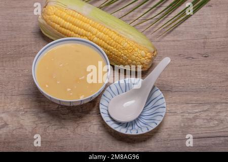 Sweet corn soup in a ceramic cup on wooden background.copy space Stock ...