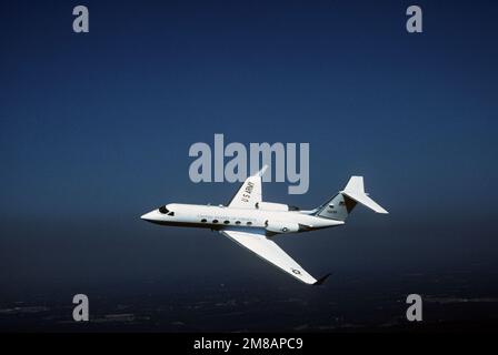 An air-to-air left side view of a C-20E Gulfstream III aircraft. The ...