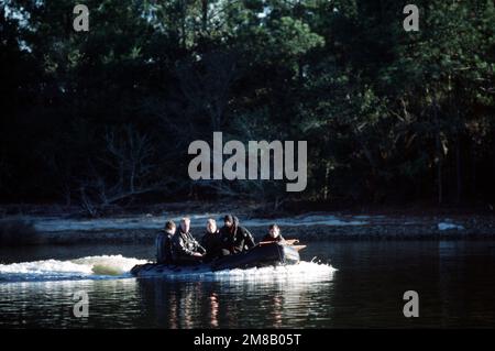 An Army Special Forces Zodiac raft is loaded into an MH-53J Pave Low ...