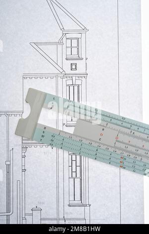 Architects drawings with a slide ruler. An old fashioned way to make ...