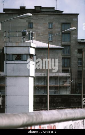 East German Border Guards patrol the Berlin Wall in East Germany in ...