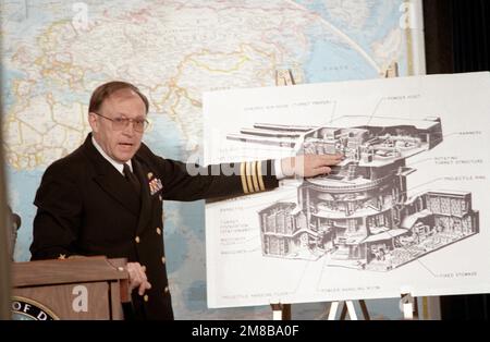 Using a diagram of a 16-inch gun turret, Captain Larry Seaquist briefs ...