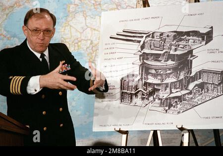 Using a diagram of a 16-inch gun turret, Captain Larry Seaquist briefs ...