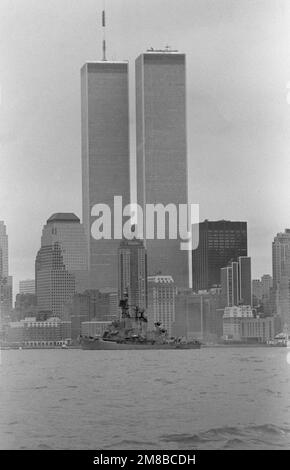 The guided missile destroyer USS MACDONOUGH (DDG-39) steams between a ...
