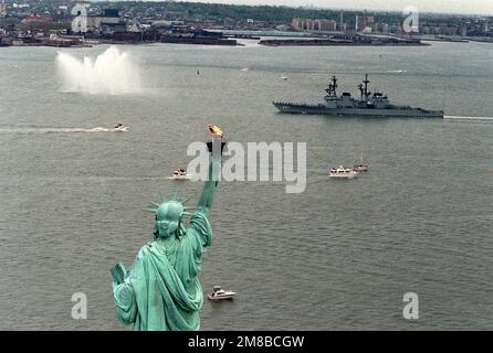 Crew members man the rail aboard the first Aegis guided missile cruiser ...