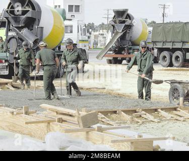 Seabees smooth down cement for new sections of the flight line. Base ...