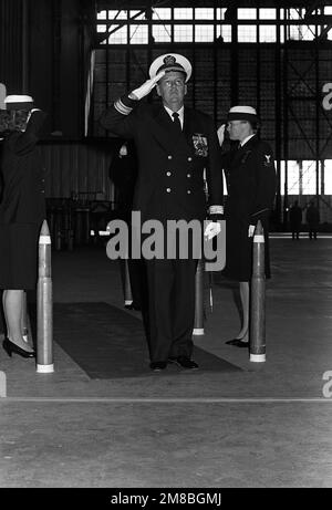 Rear Adm. (lower half) Thomas A. Mercer poses for photo with his family ...