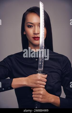 Ninja samurai warrior fighter with a sword and shuriken over black background. japanese fighter ...