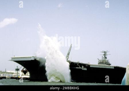 An 82,700-pound test sled speeds down the No. 4 catapult on the flight ...