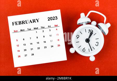 February 2023 Monthly calendar year and alarm clock with keyboard ...