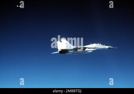 A right side view of a Soviet MiG-31 Foxhound fighter aircraft in ...