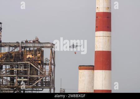 Cuban armed forces helicopter putting out the fire from the explosion ...