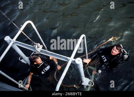The salvage and rescue ship USS EDENTON (ATS 1) positions itself in ...