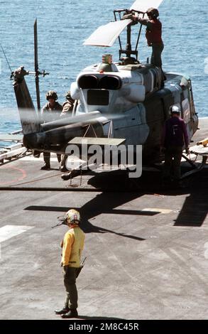 A UH-1N Iroquois helicopter is refueled in preparation for a mission ...