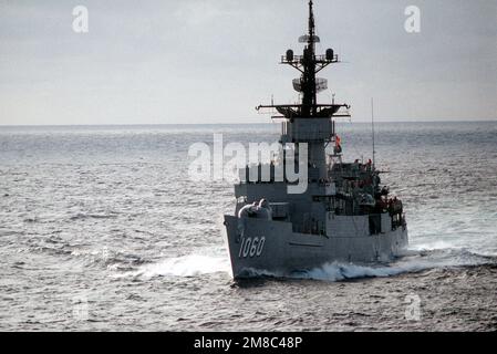 The frigate USS LANG (FF 1060) is replenished underway by the ...