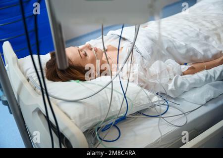 Lady having treatment in intensive care in clinic Stock Photo - Alamy