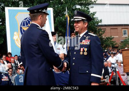 GEN Larry D. Welch, left, CHIEF of STAFF, U.S. Air Force, presents a ...