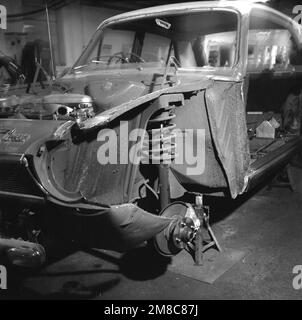 1950s, historical picture of an inside a garage, work, car ramps ...
