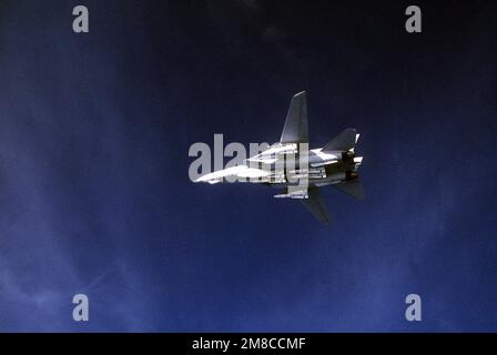 An air-to-air left underside view of an F-14A Tomcat aircraft before ...