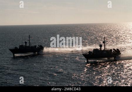 The patrol combatant missile hydrofoils USS TAURUS (PHM-3), foreground ...
