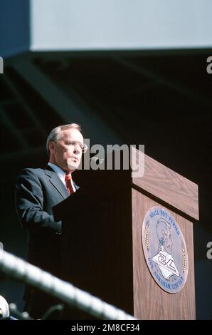 Secretary of the Navy H. Lawrence Garrett III speaks with a guest at ...