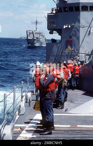 Crew members aboard the tank landing ship USS SPARTANBURG COUNTY (LST ...