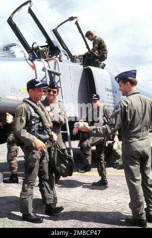 A member of the 3rd Tactical Fighter Wing stands flight line duty ...