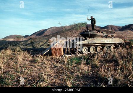 Soldiers set up an M-551 Sheridan light tank that has been air-dropped ...