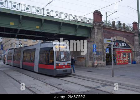 A Siemens ELIN Ultra Low Floor tram operating beside the statue of Karl ...