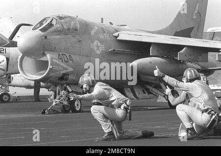 A catapult officer signals for the launch of an Attack Squadron 196 (VA ...