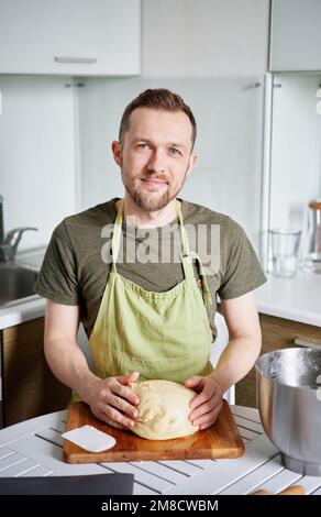 bearded man chef with bread in hand culinary industry Stock Photo - Alamy