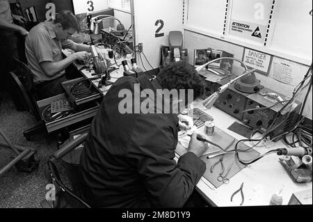 Aviation Fire Control Technician 3rd Class Charles M. Kyle uses a ...